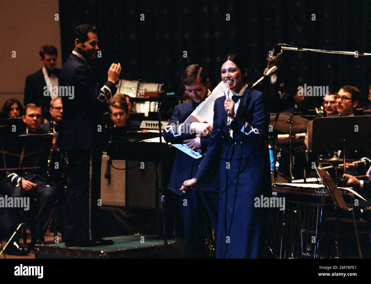 A female member of the U.S. Air Force band sings during a concert at D ...