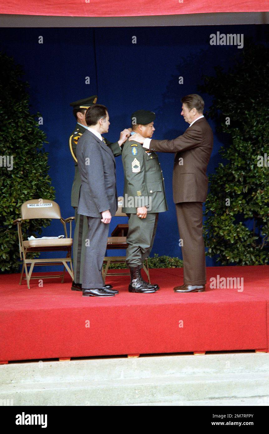 President Ronald Reagan, right, presents retired MASTER SGT. Roy P ...