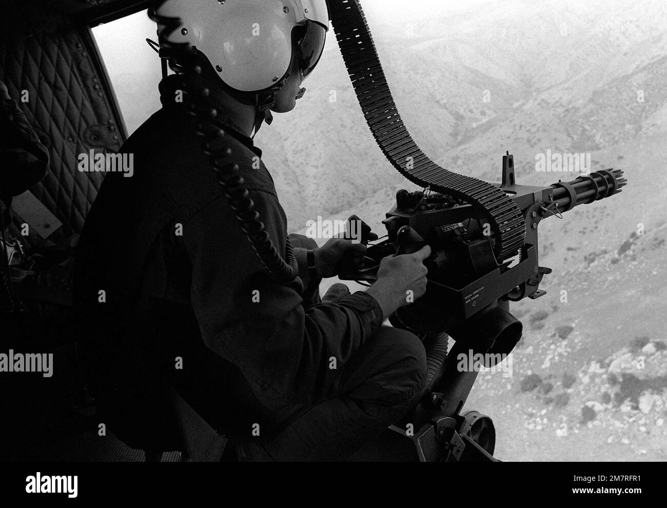 SGT James D. Rowe, a Marine gunner, fires the GAU/2B machine gun from ...