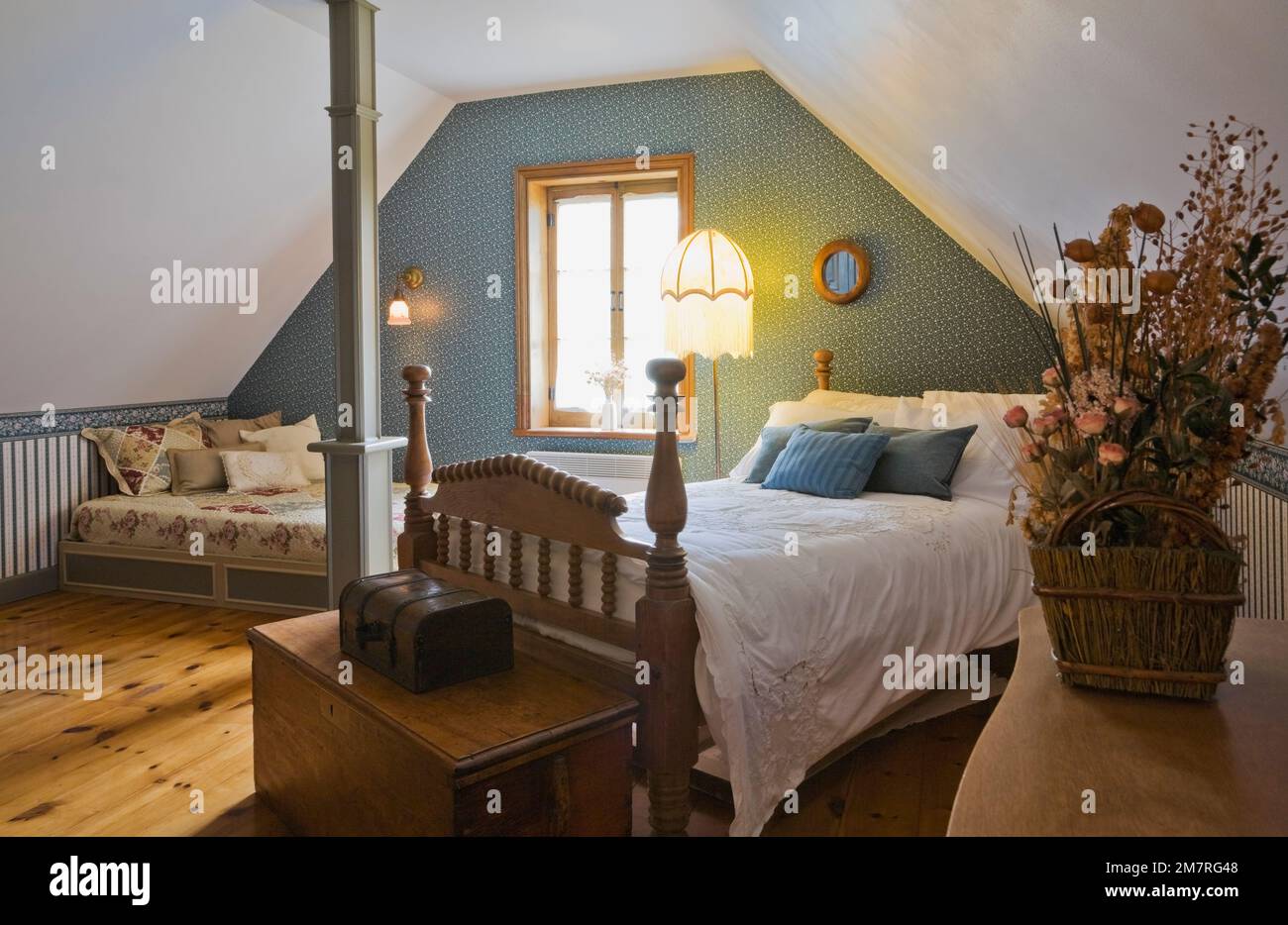 Wooden chest table and antique spool bed plus platform bed in guest ...
