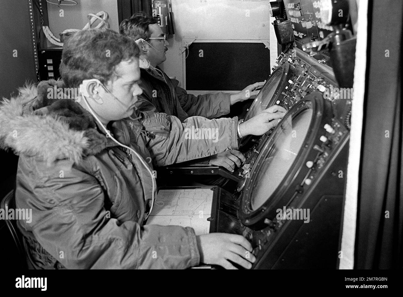 Radar operators monitor radar scopes at a Falcon radar site. The ...