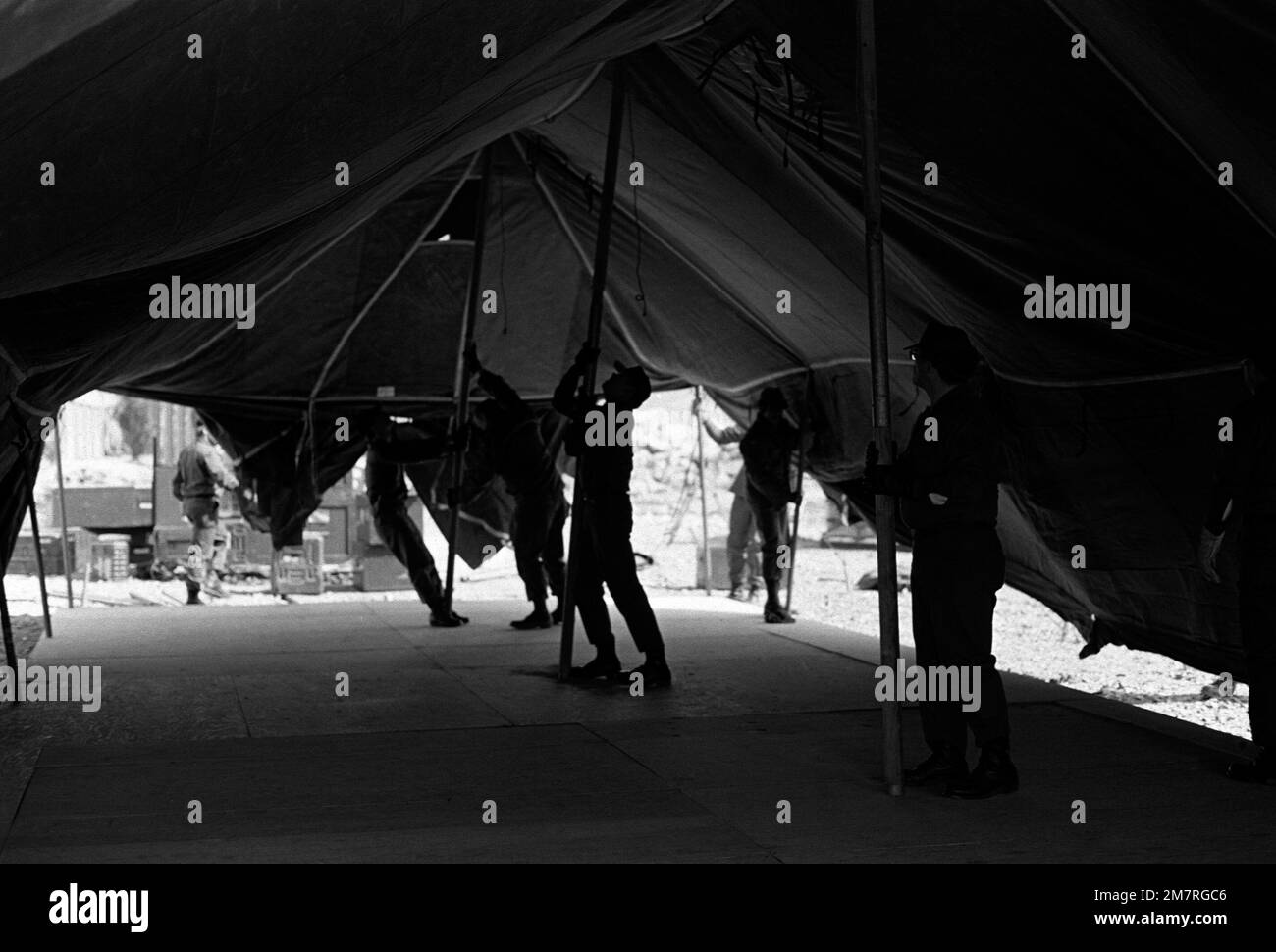 Airmen erect a tent in the tent city for Exercise Team Spirit '81. The ...