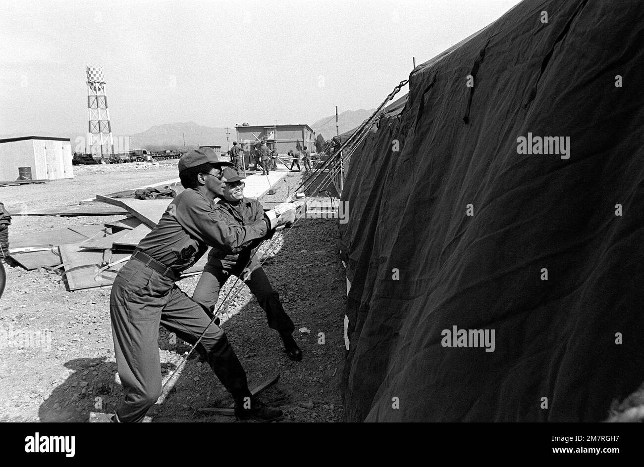 Airmen From The 655th Tactical Field Hospital Squadron Secure A Tent In The Tent City With