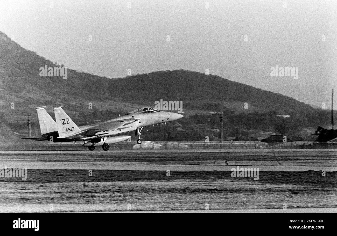 Right side view of an F-15 Eagle aircraft taking off. The aircraft is ...