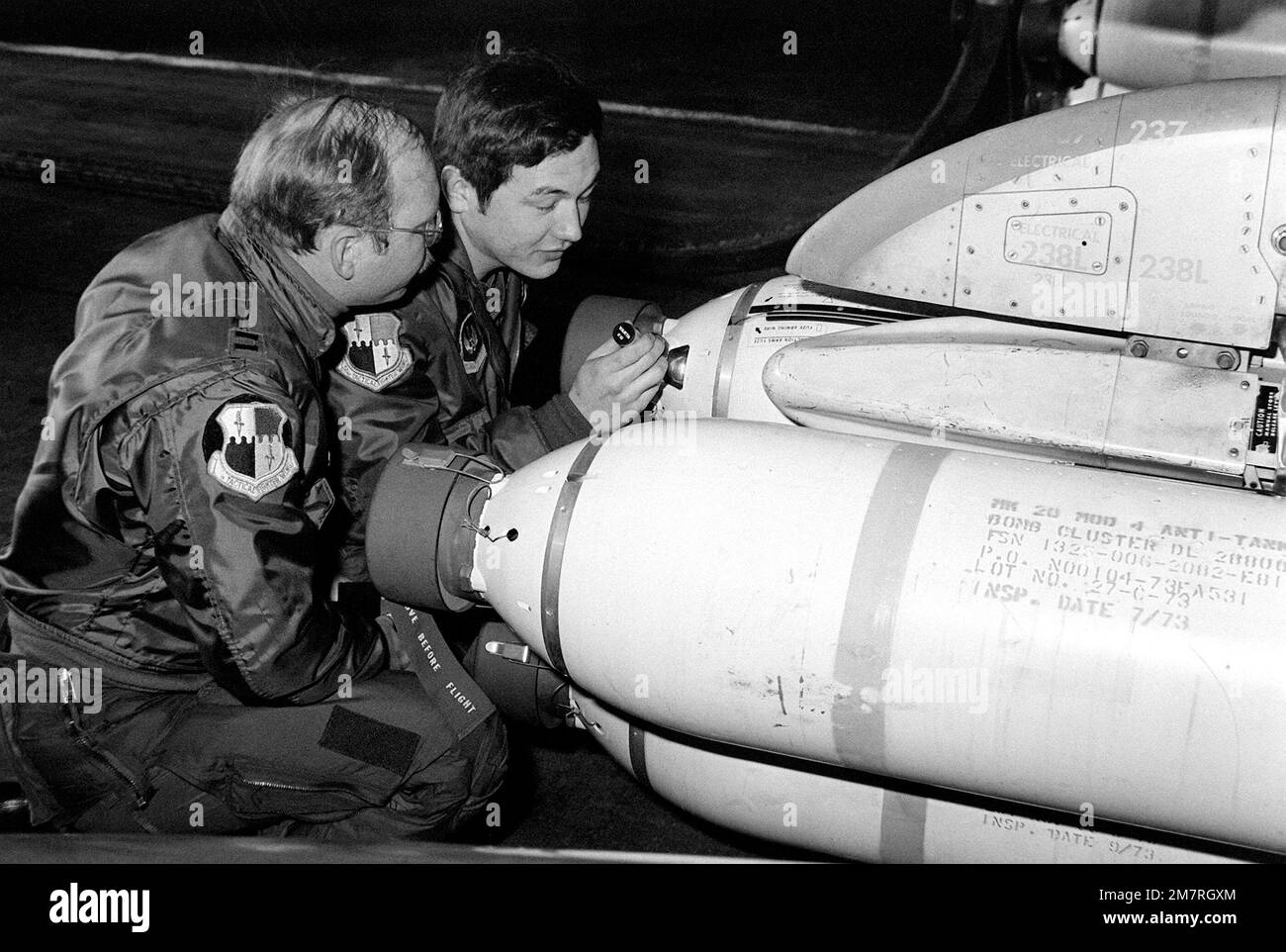 Pilots check Mark 339 fuse settings on Mark 20 Rockeye bombs loaded on ...