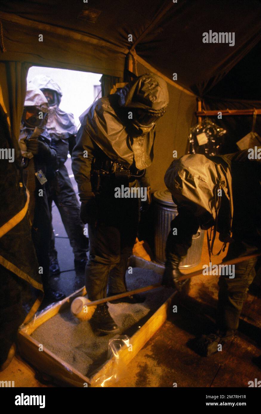 Air crewmen go through decontamination procedures following their ...