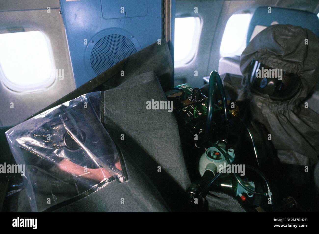 A C-141 Starlifter aircraft lands during a chemical warfare training ...