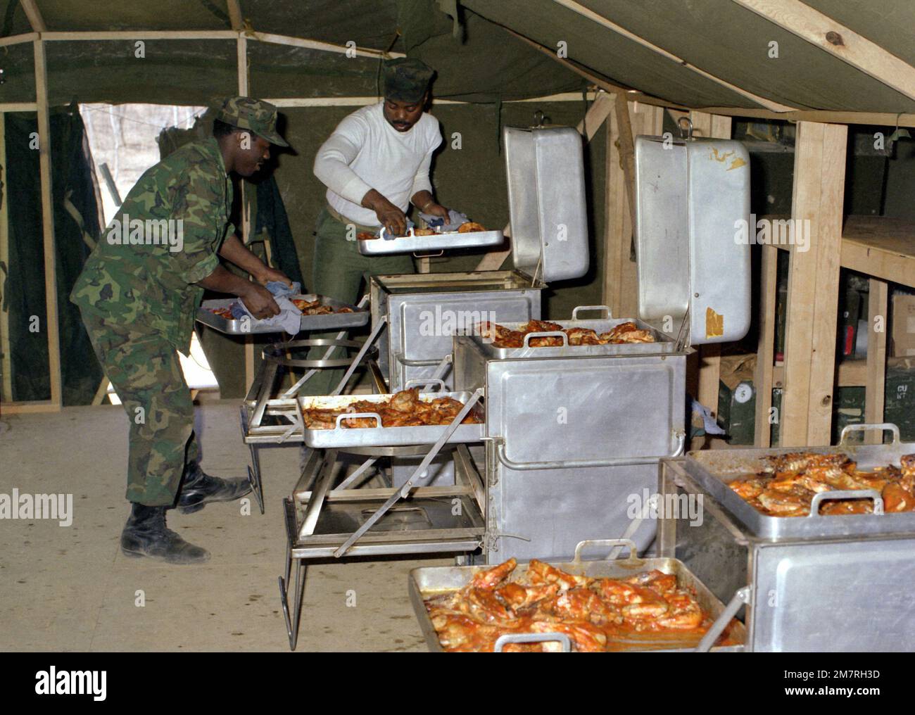 Two Marine cooks from Marine Aircraft Group 12 (MAG-12) prepare a big ...