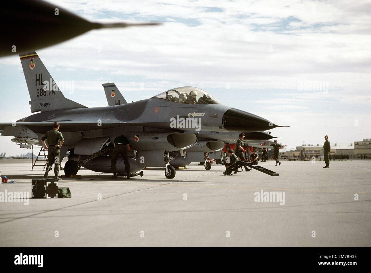 Ground crewmen prepare to marshal an F-16A Fighting Falcon aircraft out ...