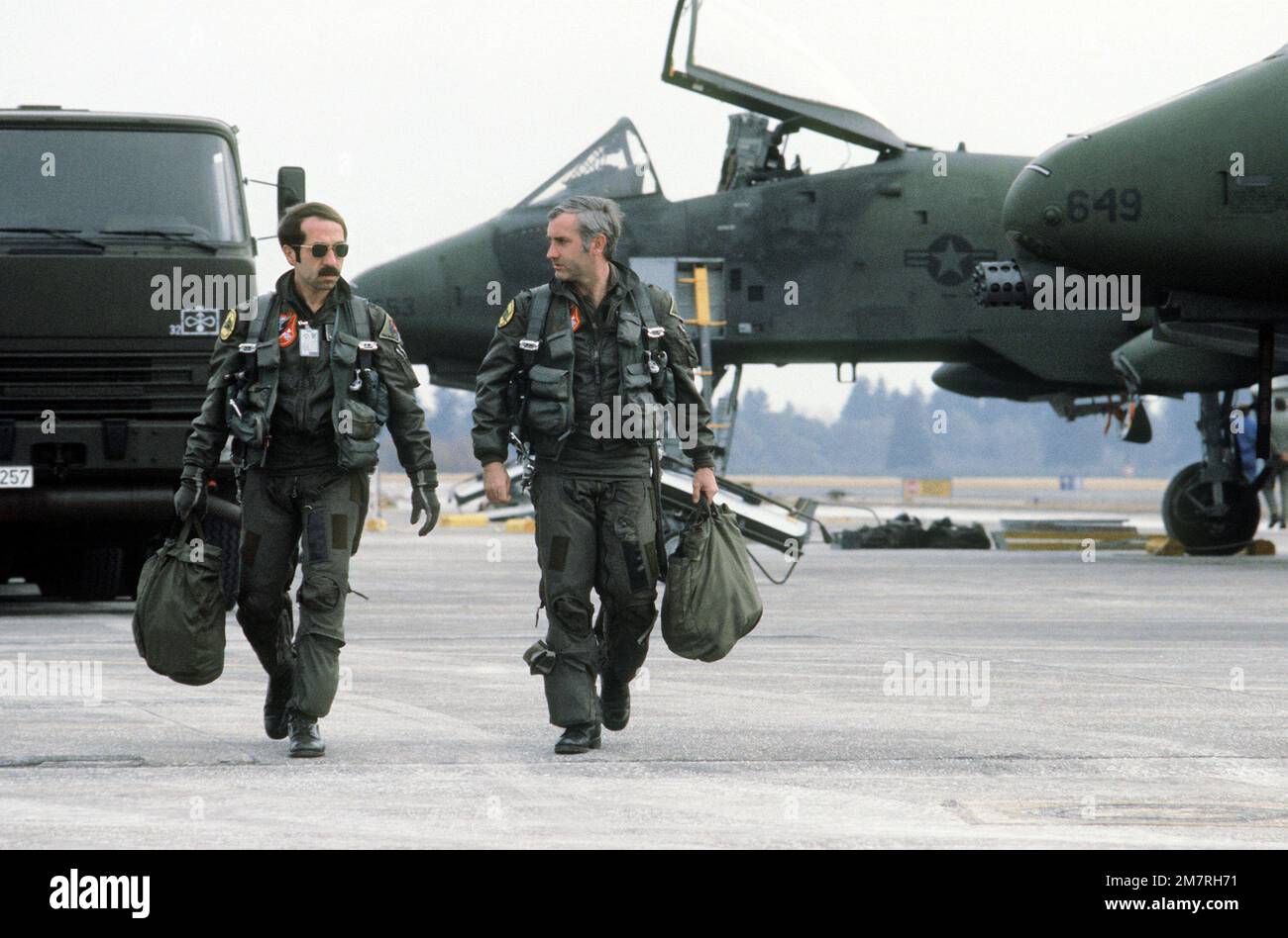 MAJ Brent Richardson, left, and CPT Bob Rose walk away from their A-10 ...
