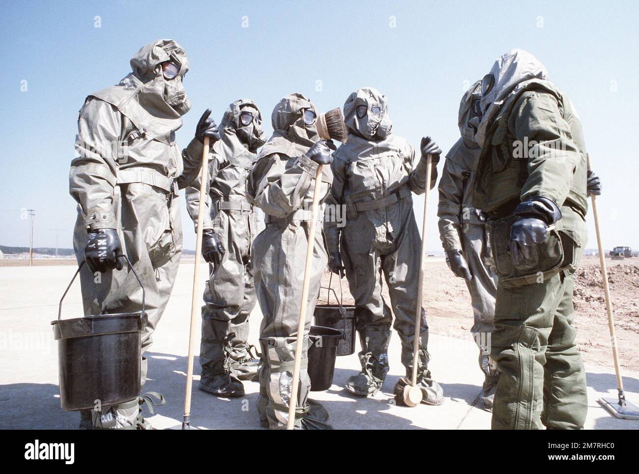 8th Security Police Squadron members, clad in chemical warfare gear ...