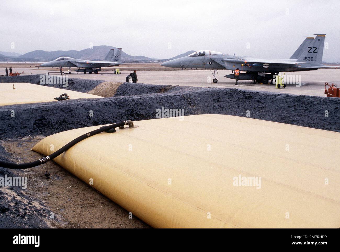 18th Tactical Fighter Wing F-15 Eagle aircraft are refueled from fuel ...