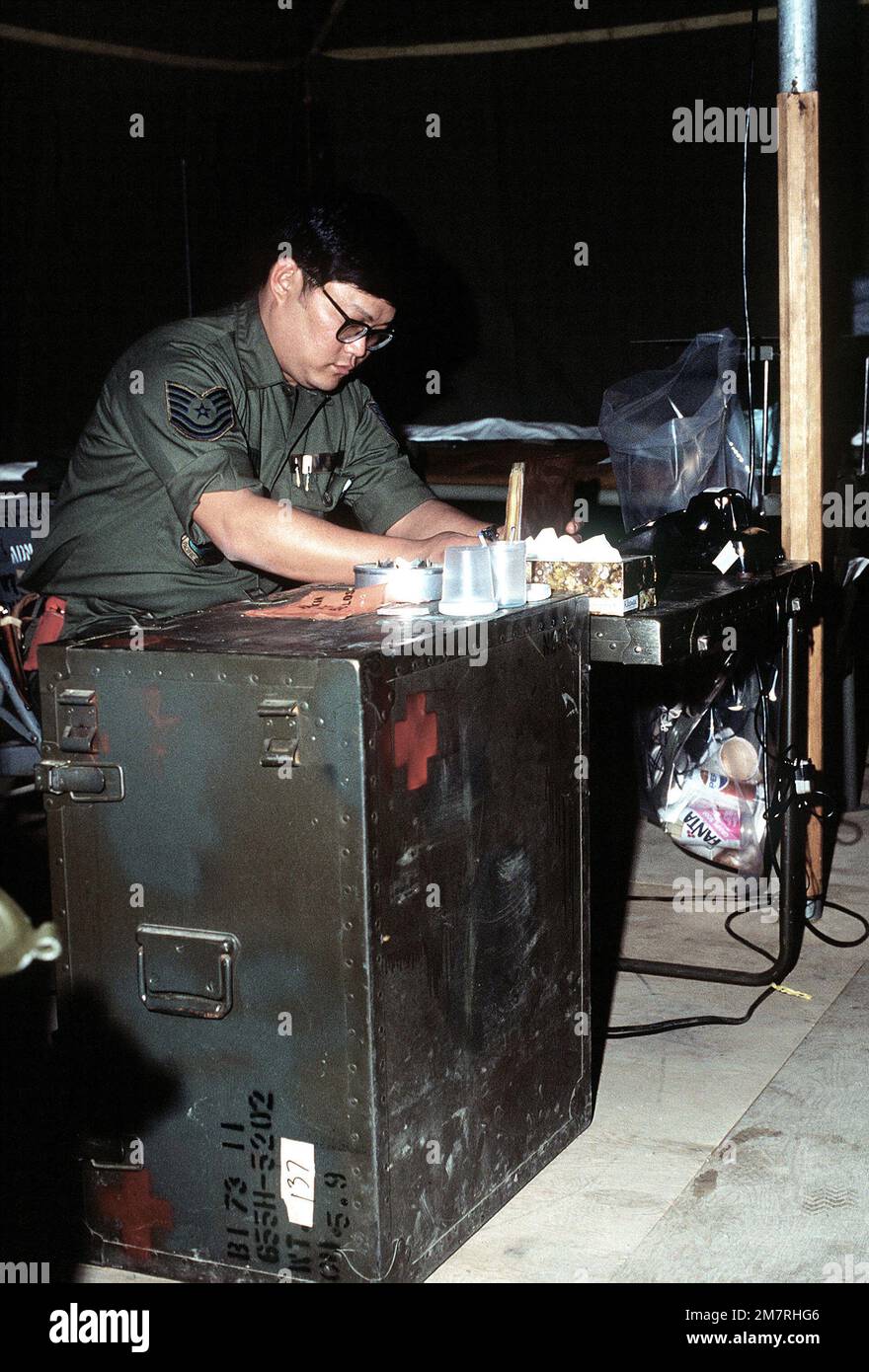 TSGT Gordon Fujii, from the 655th Tactical Hospital, works in the tent ...