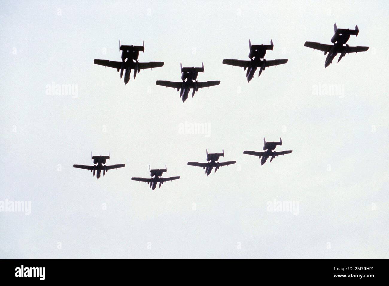 Eight A-10 Thunderbolt II aircraft perform a fly-over at the air base ...