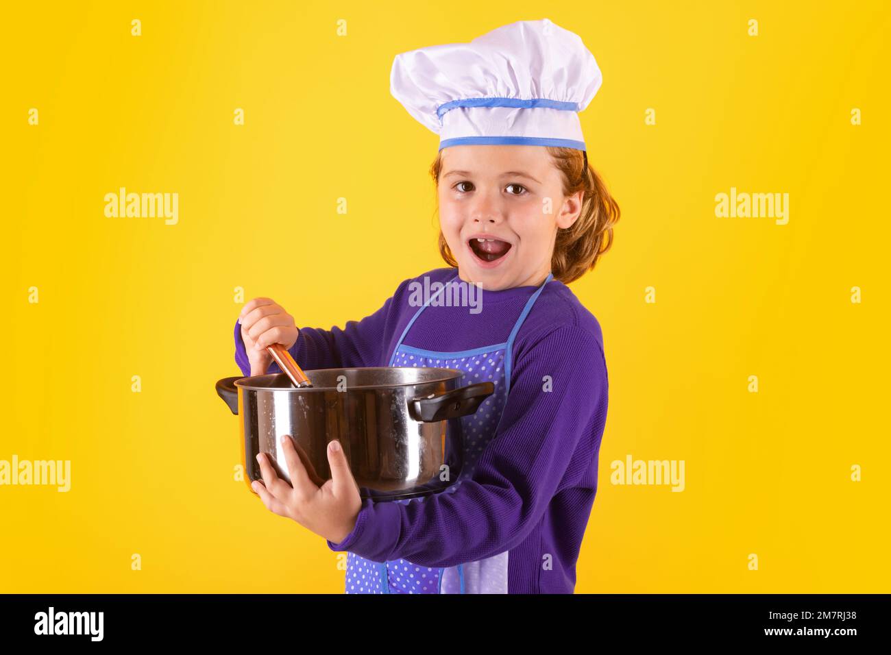 Kid cook with cooking pot and ladle. Child chef cook, studio portrait ...
