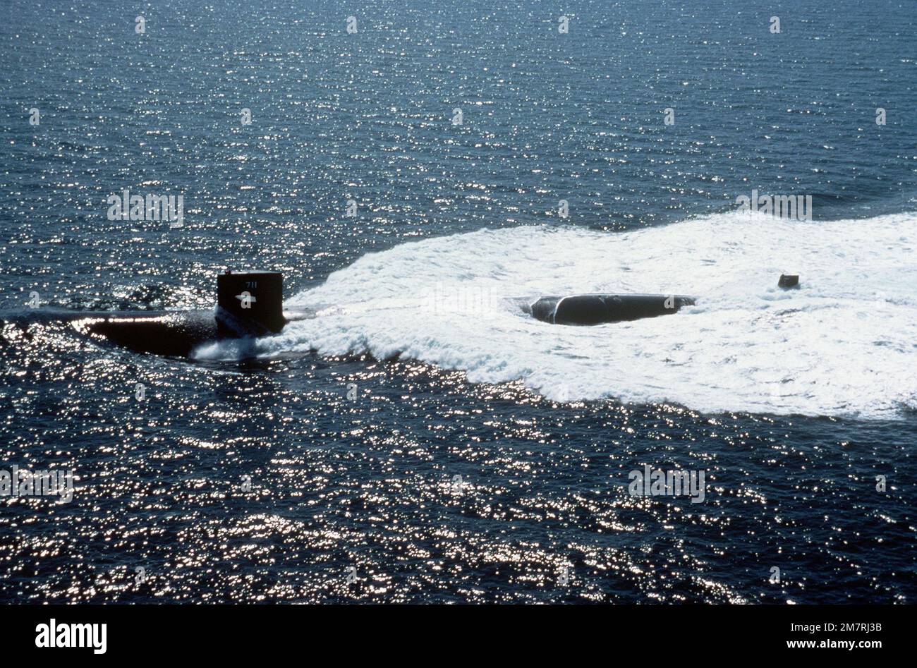 An aerial port beam view of the nuclear-powered attack submarine SAN ...
