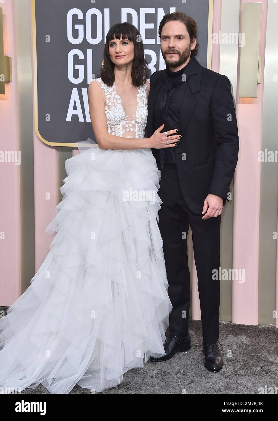 Felicitas Rombold, left, and Daniel Brühl arrive at the 80th annual ...