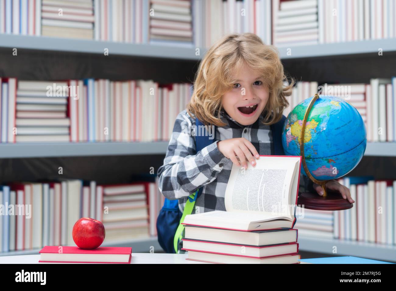 Excited pupil. Back to school. Funny little child from elementary ...