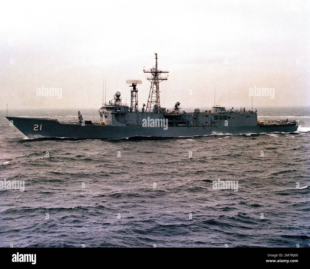 An aerial port side view of the Oliver Hazard Perry class guided ...