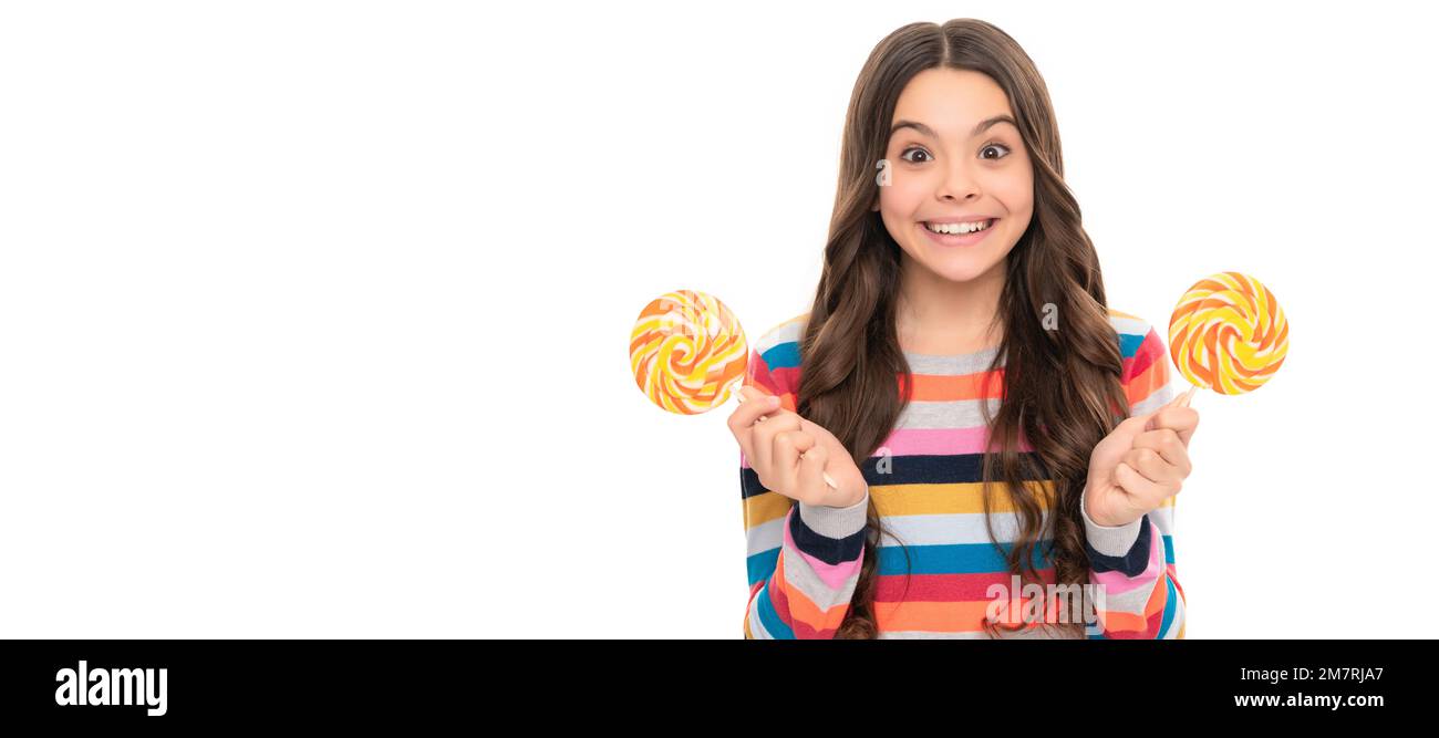 surprised kid in sweater with lollipop candy on stick isolated on white ...