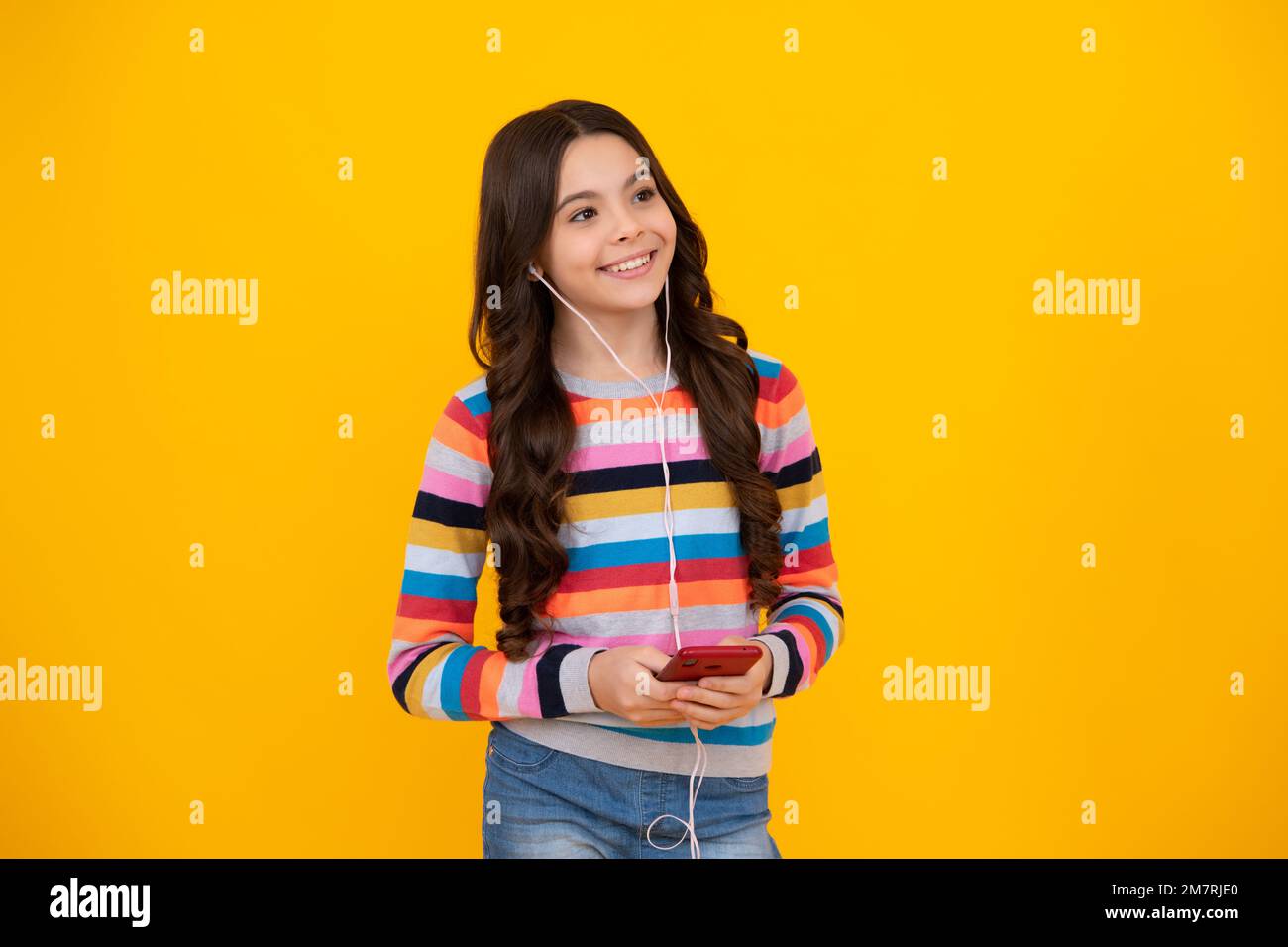 Teenage girl with smart phone. Portrait of teen child using mobile ...