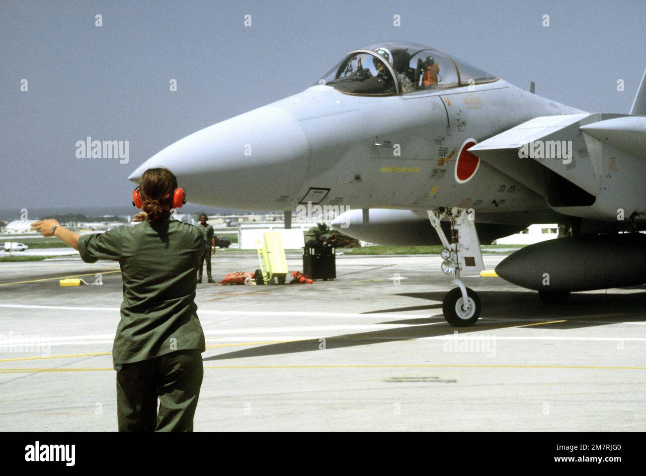 SRA Carolyn Liddiard directs a Japanese Air Self Defense Force F-15 ...