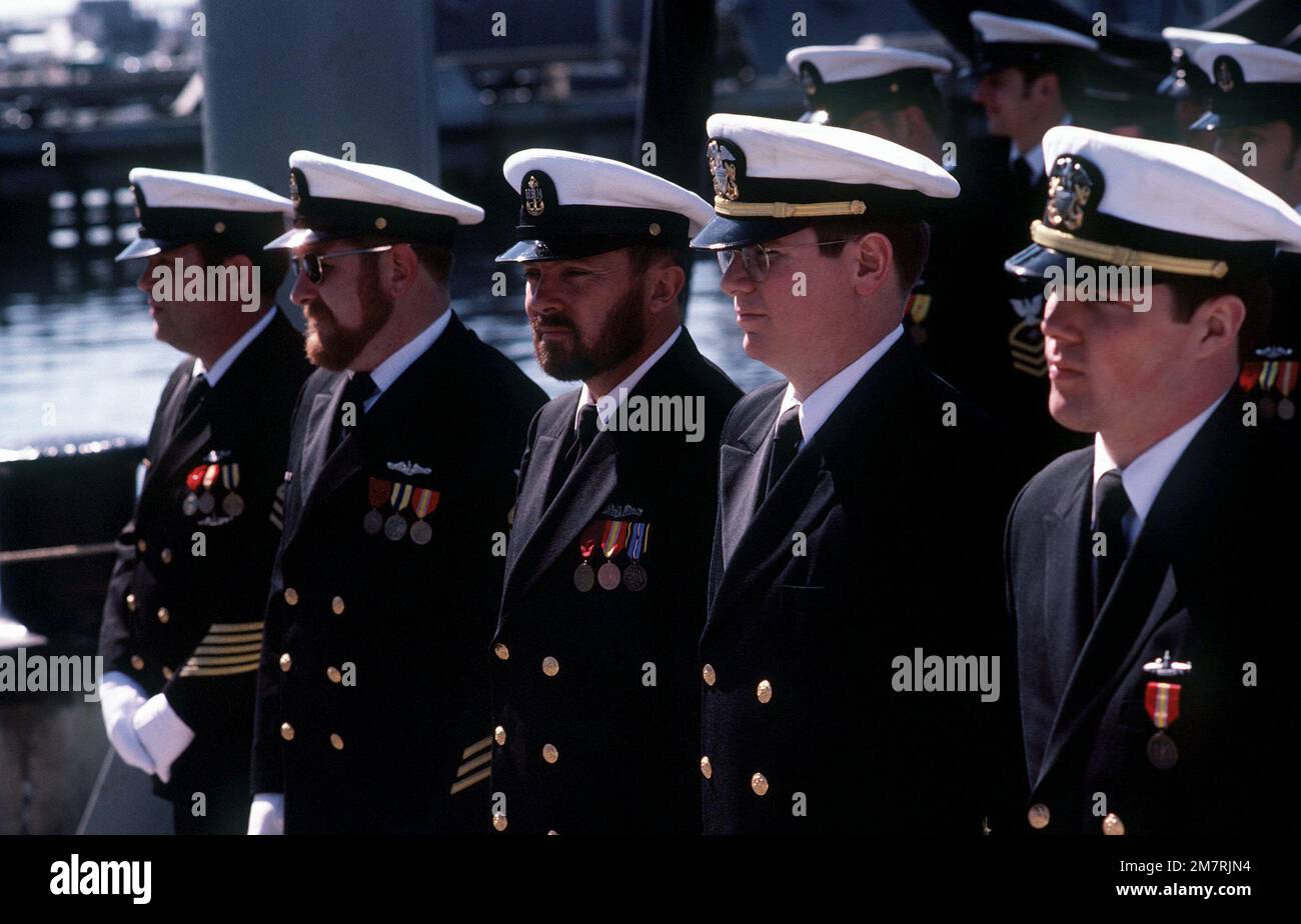 Officers and crew from the nuclear-powered attack submarine USS ...