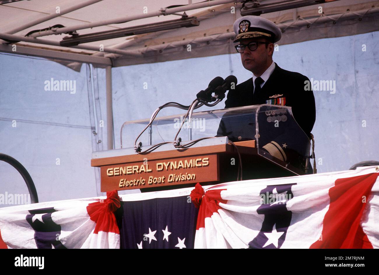 RADM Carl A. Brettschneider speaks at the commissioning ceremonies for ...