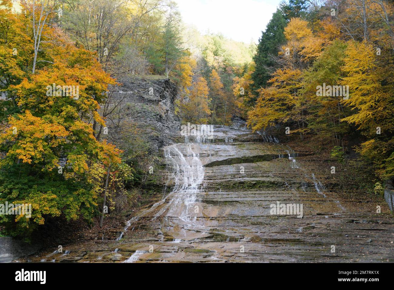 Beautiful waterfalls from above the hills with the background of fall ...
