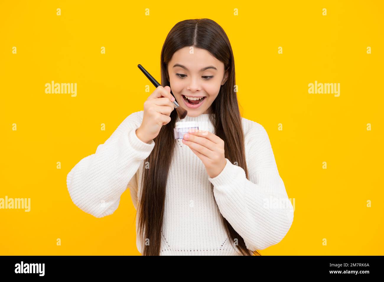 Beautiful portrait of teen girl child artist apply powder with make up ...