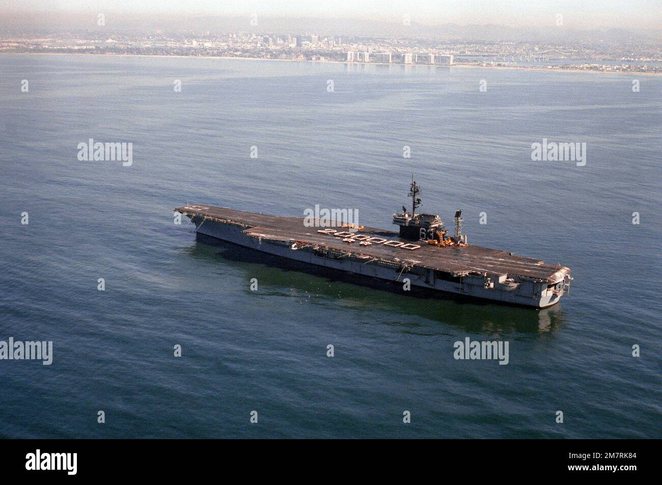 A port quarter view of the USS KITTY HAWK (CV-63) as crewmen form the ...