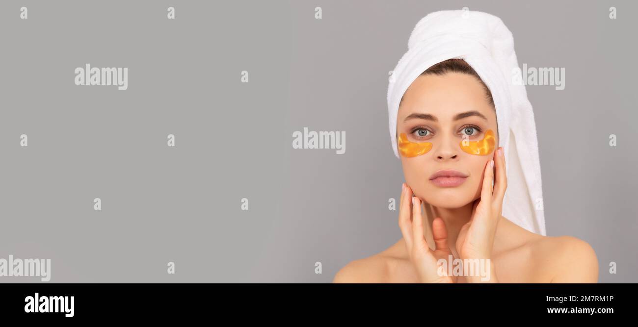 Eye patches, patch under eyes. beautiful girl with terry towel use ...