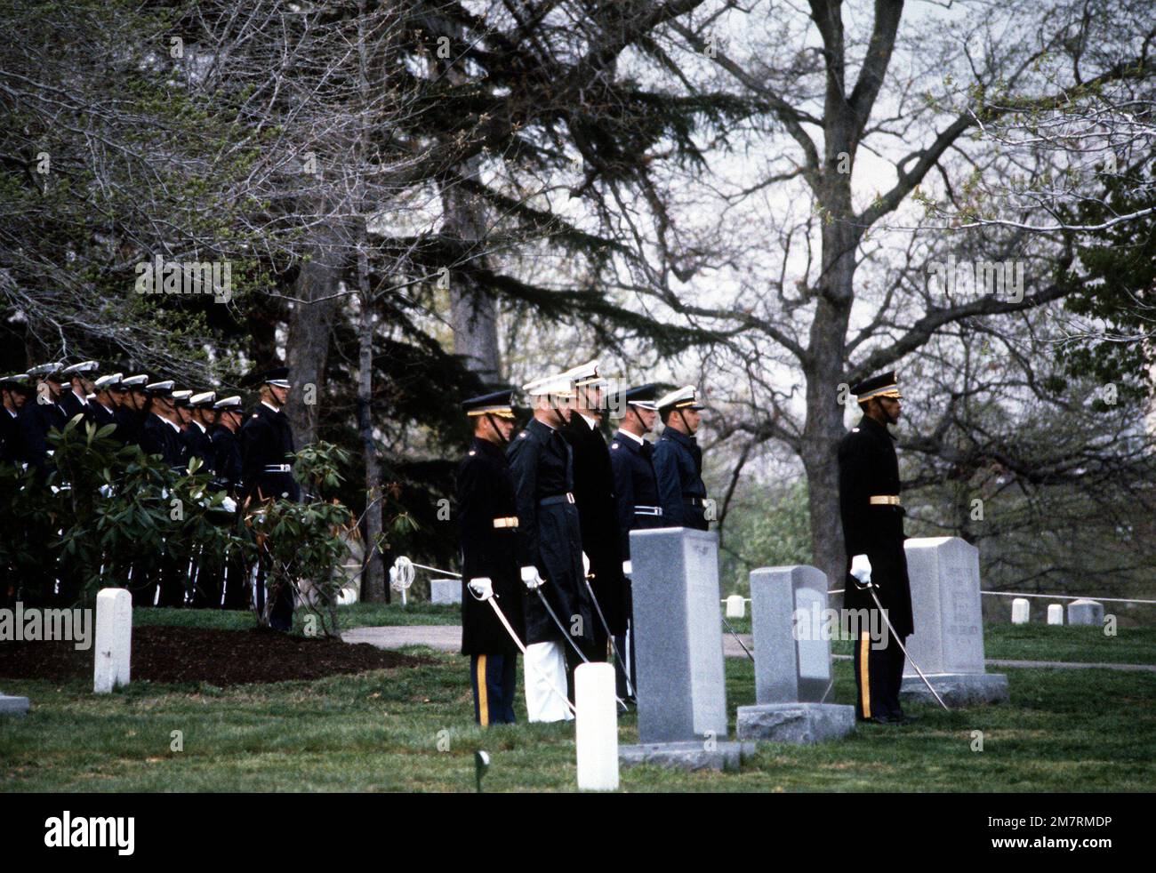 Joint-Service honor guards stand at attention during the funeral of GEN ...