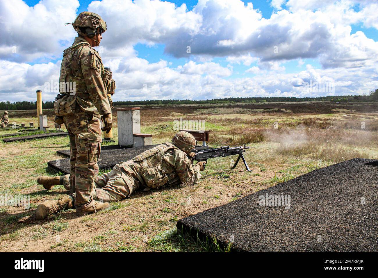 U.S. Army Cpl. Joshua Rangel, standing, assigned to Charlie Company ...