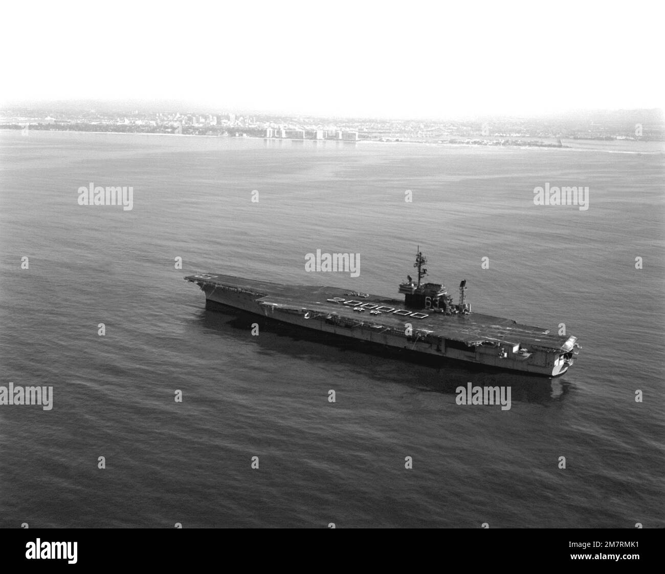 A port quarter view of the USS KITTY HAWK (CV-63) as crewmen form the ...