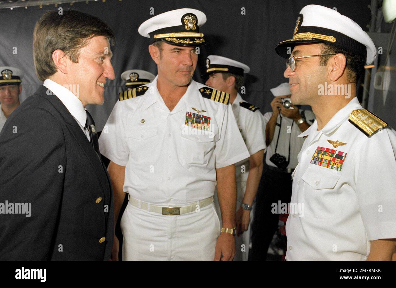 CAPT Robert C. Taylor Jr., center, commanding officer, stands with ...