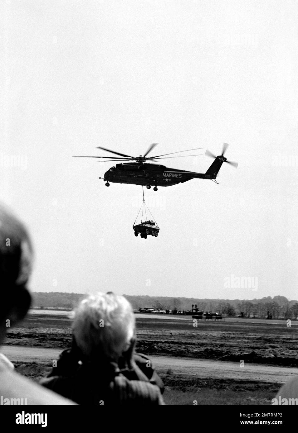 A Marine Corps CH-53E Super Stallion helicopter lifts a Canadian ...