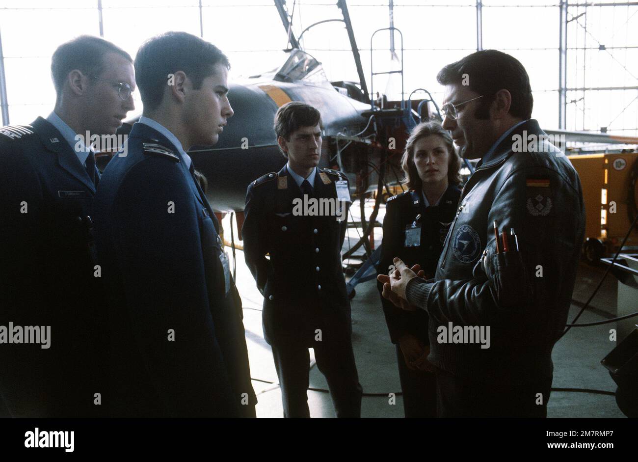 U.S. Air Force Academy cadets are briefed by a German airman, in front ...