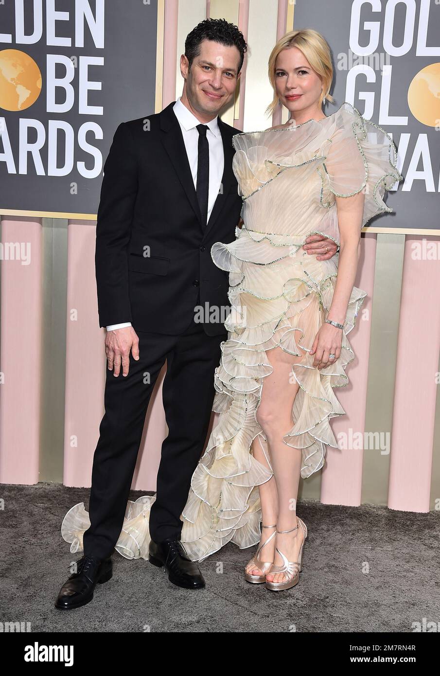 Thomas Kail, left, and Michelle Williams arrive at the 80th annual ...