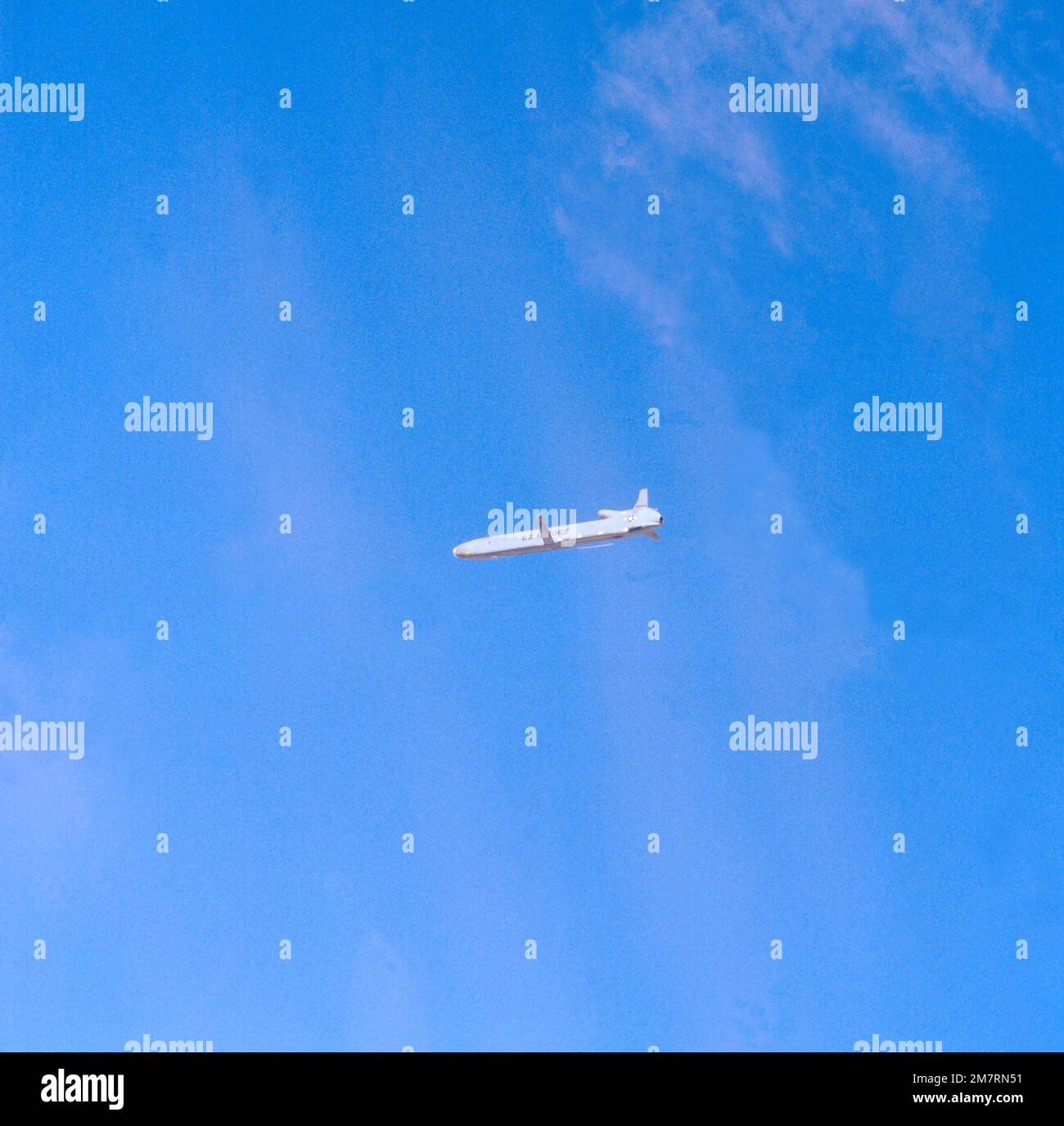 AN air-to-air side view of an AGM-86 air-launched cruise missile near ...