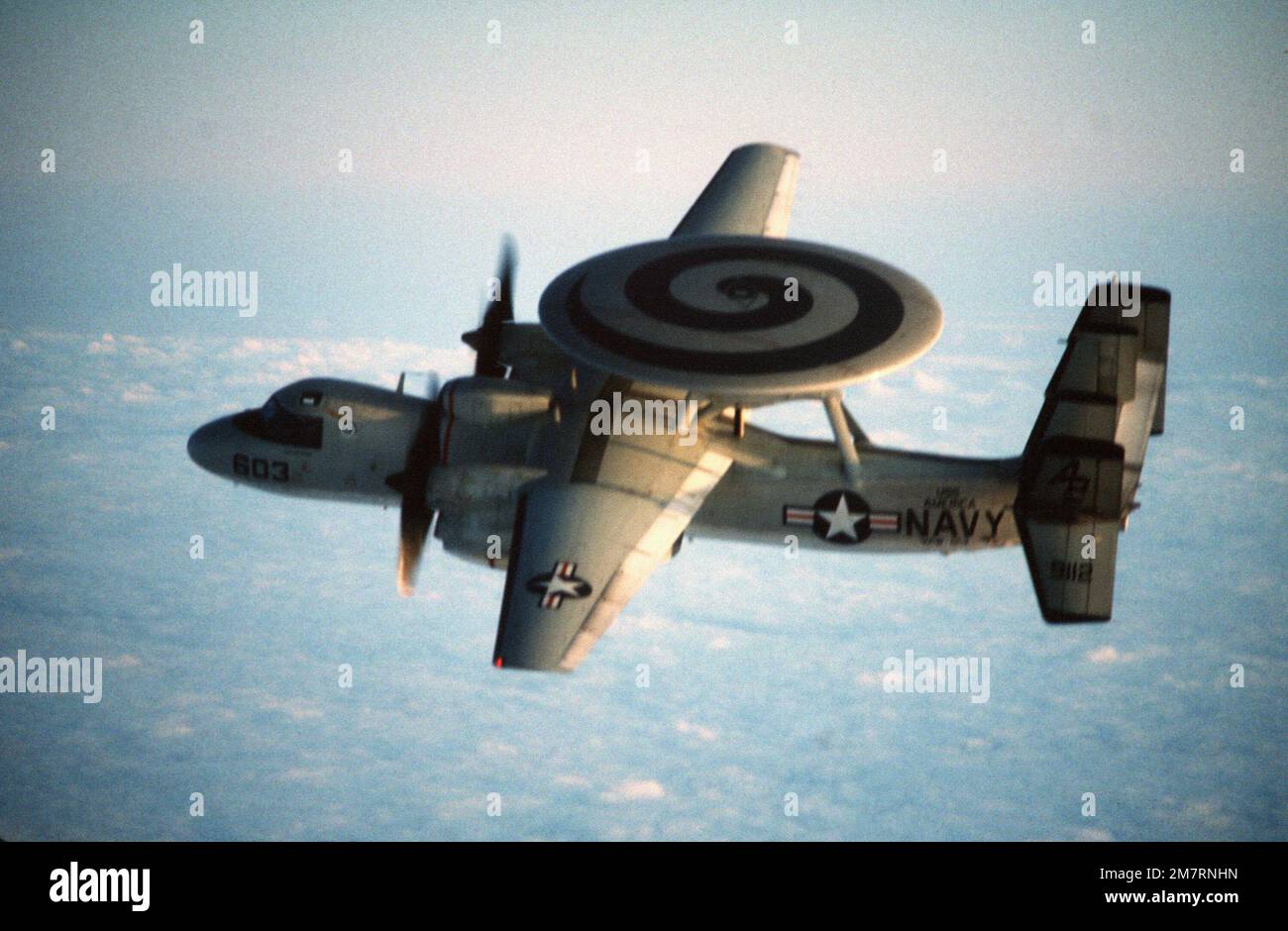 An air-to-air left side view of an E-2 Hawkeye airborne-early-warning ...