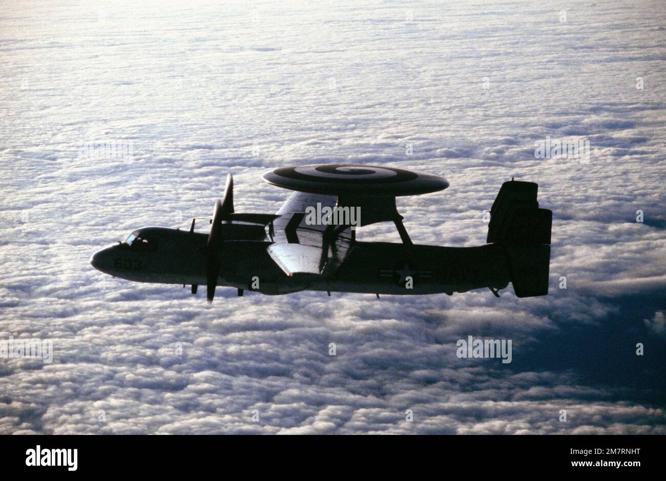 An air-to-air left side view of an E-2 Hawkeye airborne-early-warning ...