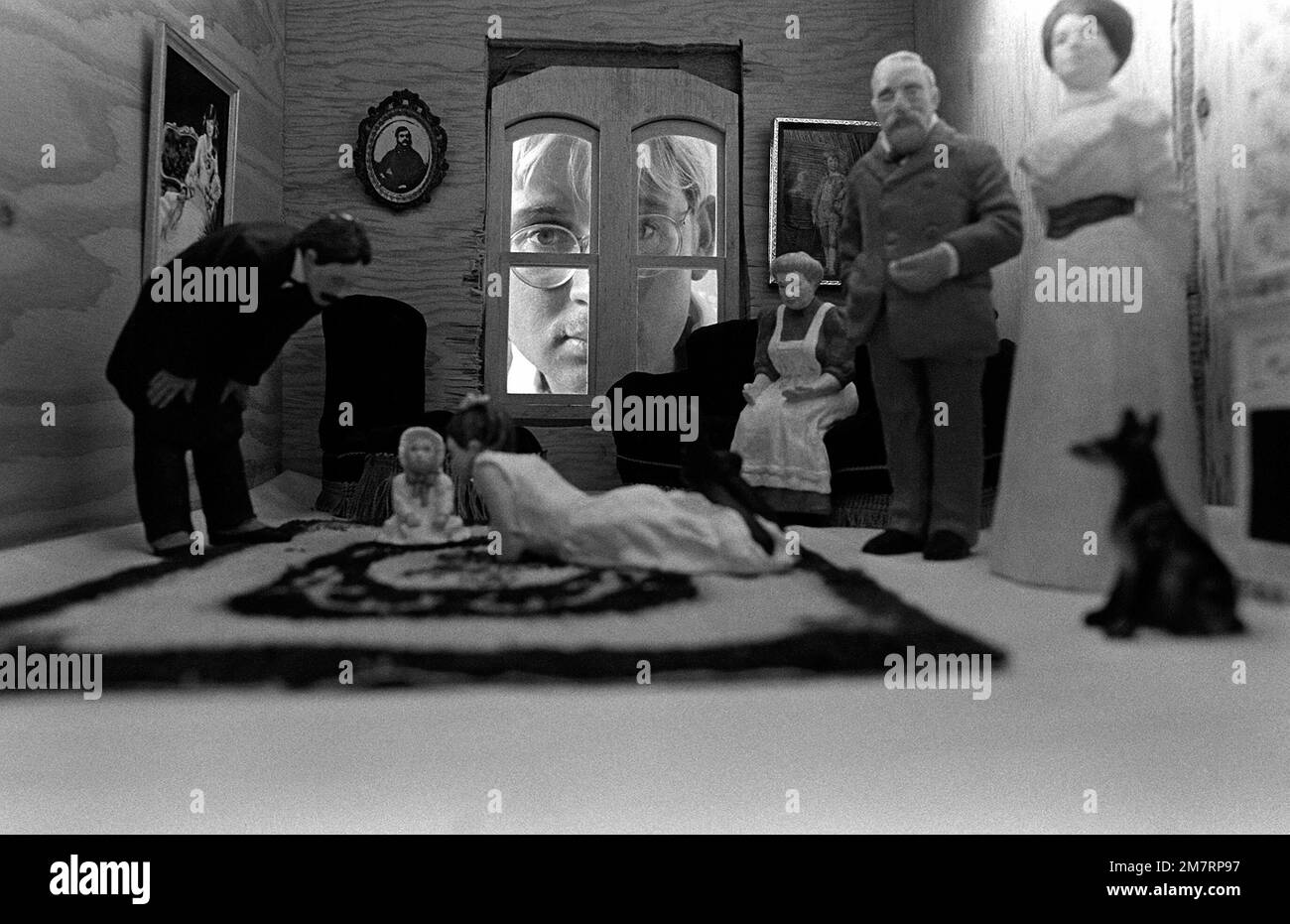 SSGT Jeff Stentz, a hospital technician, peers into a window of the ...