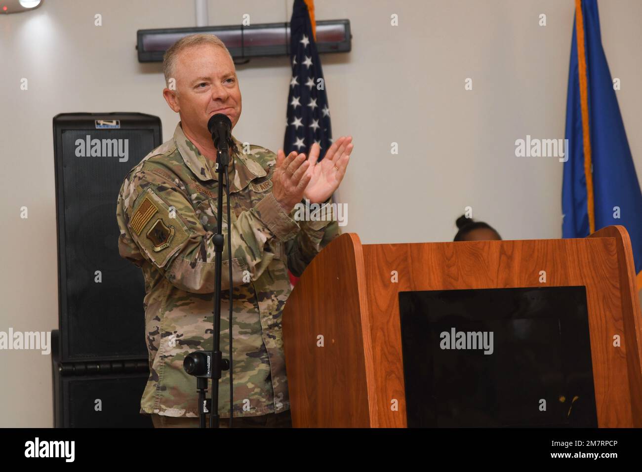 Col. Tyler R. Schaff, 316th Wing and installation commander, applauds ...