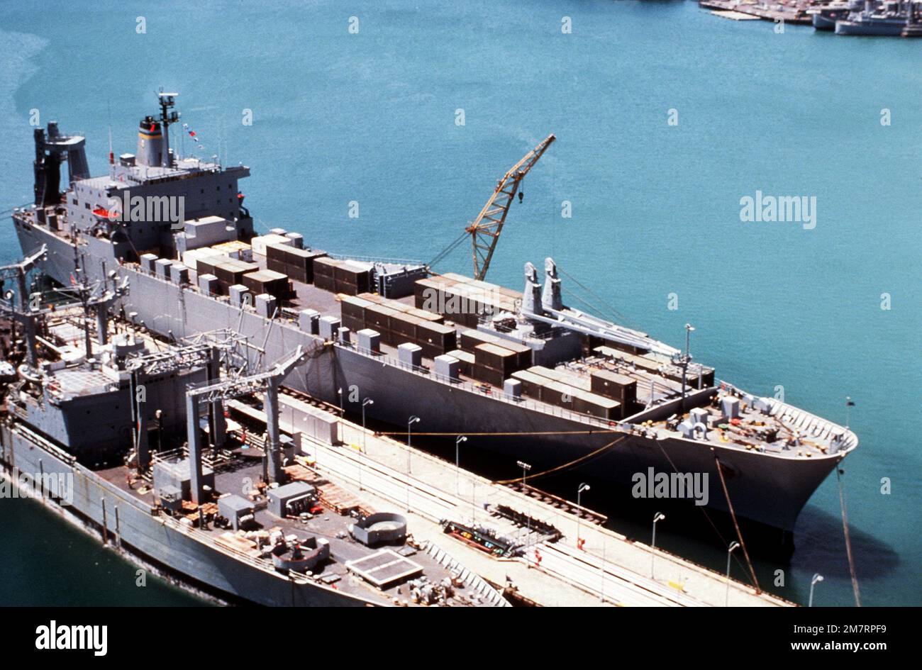 The vehicle cargo ship USNS MERCURY (T-AKR-10) is docked at the fuel ...