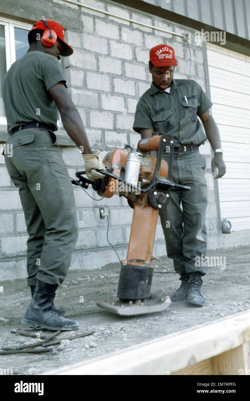 Two members of the 554th Civilian Engineering Squadron (Red Horse), at ...