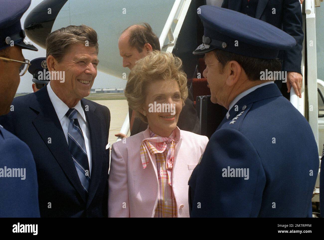 President and Mrs. Ronald Reagan are greeted by GEN Robert E. Huyser on ...