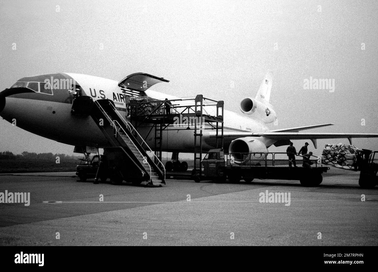 Personnel from the 5th and 435th Aerial Port Squadrons off load a KC-10 ...