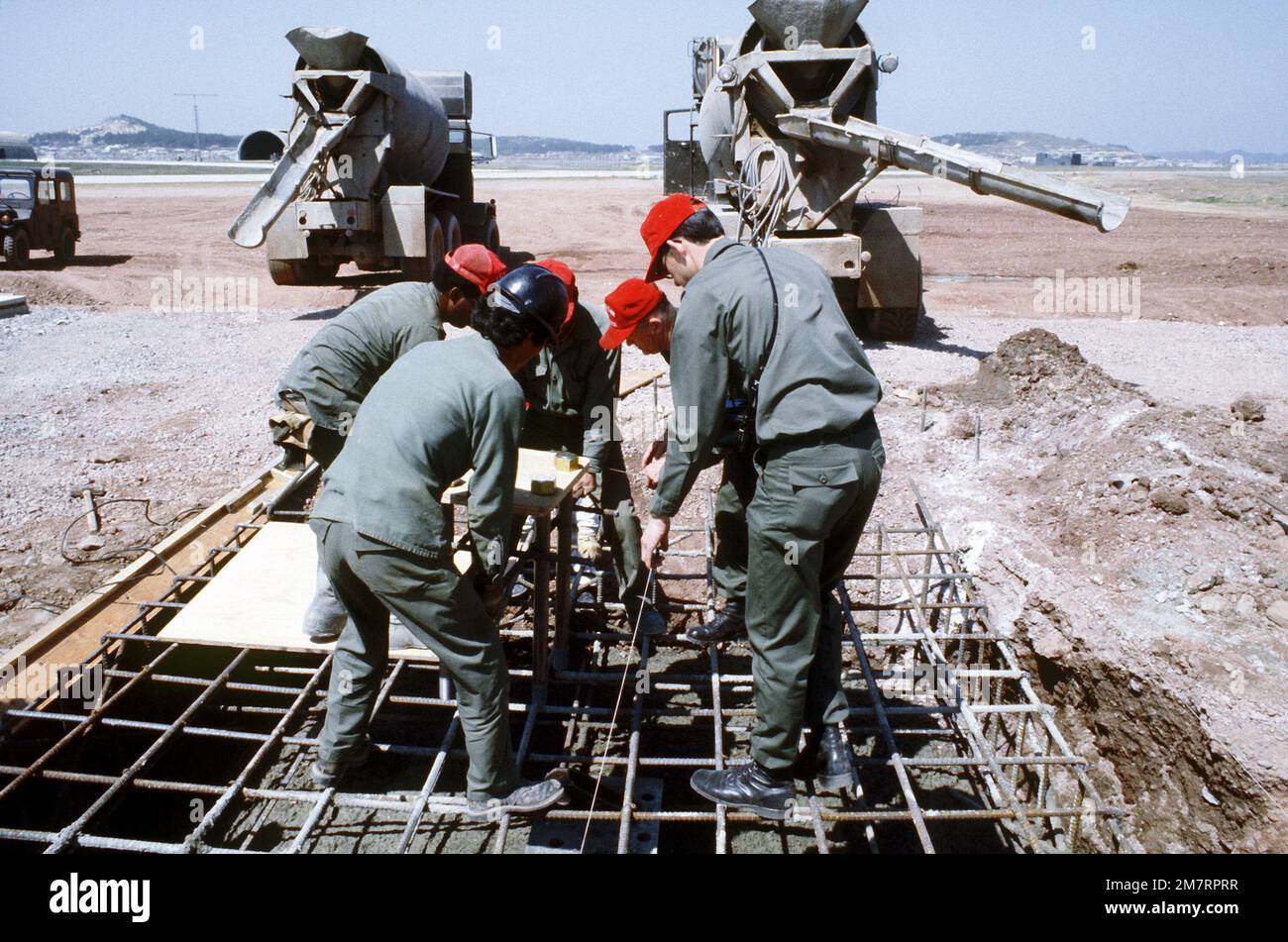 Members of the 554th Civil Engineering Squadron (Red Horse) position an ...