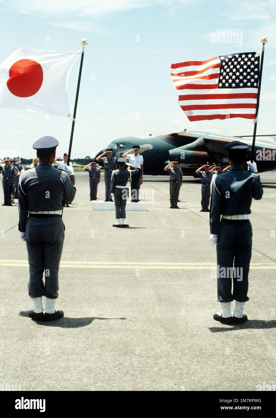 A Japanese Air SelF Defense Force honor guard stands on the runway ...
